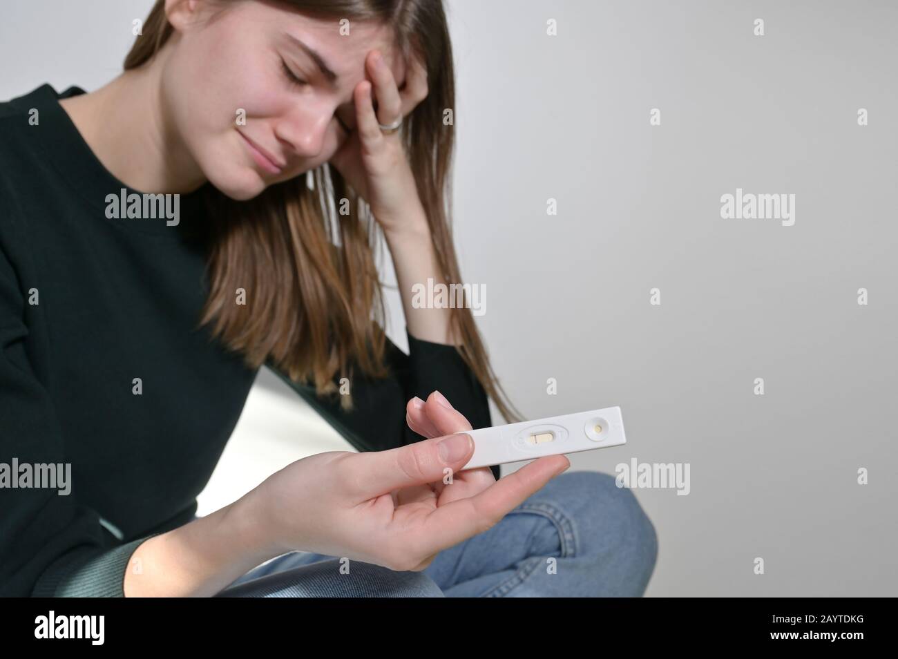 Negative Pregnancy Test. Sad Young Woman, Infertility Stock Photo - Alamy
