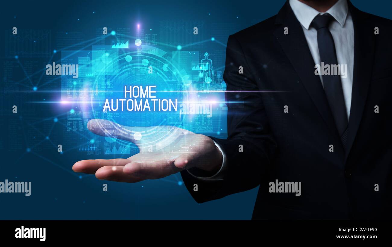 Man hand holding HOME AUTOMATION inscription, technology concept Stock ...