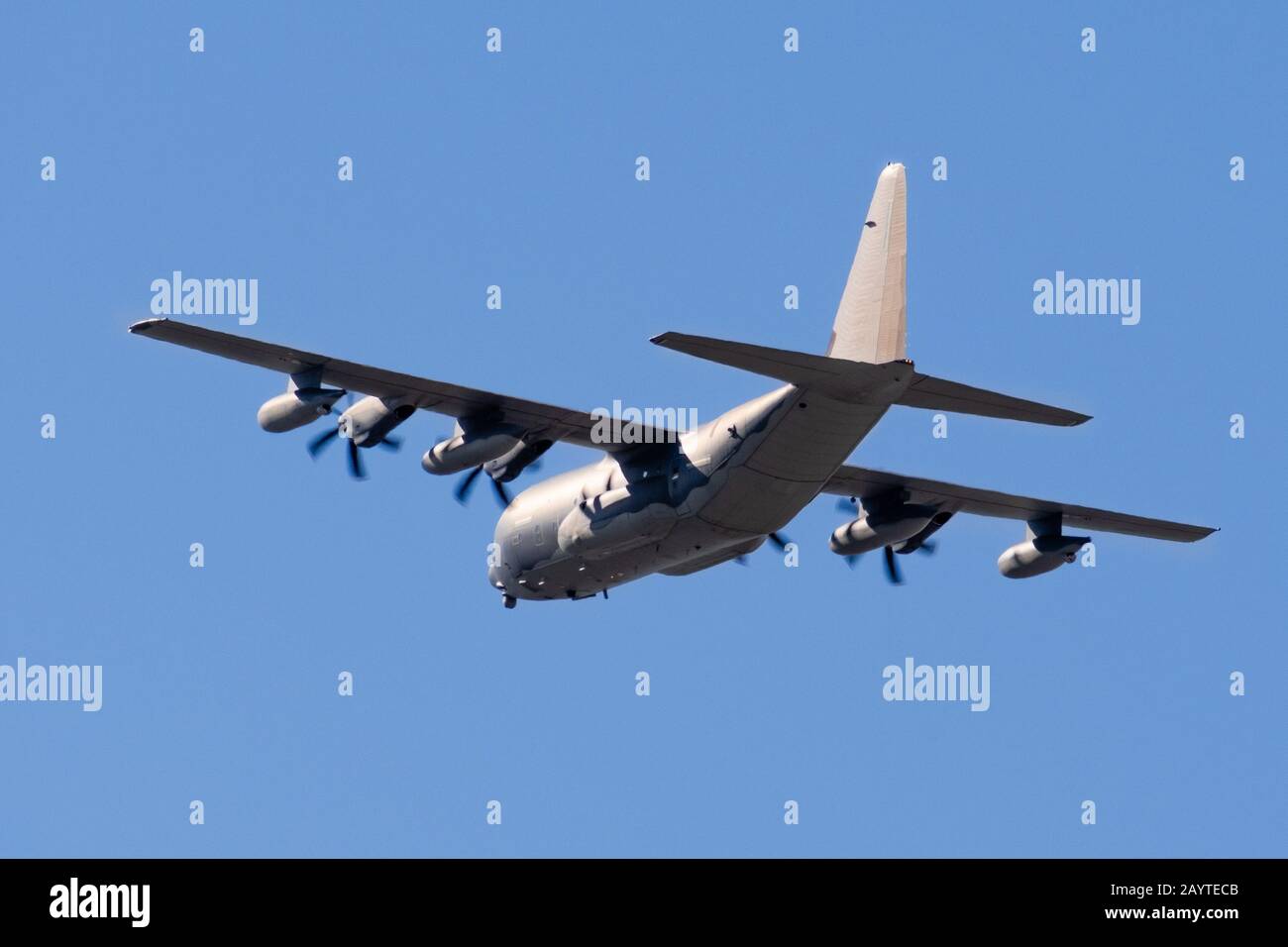 Back view of mid flight military transport aircraft; Mountain View ...