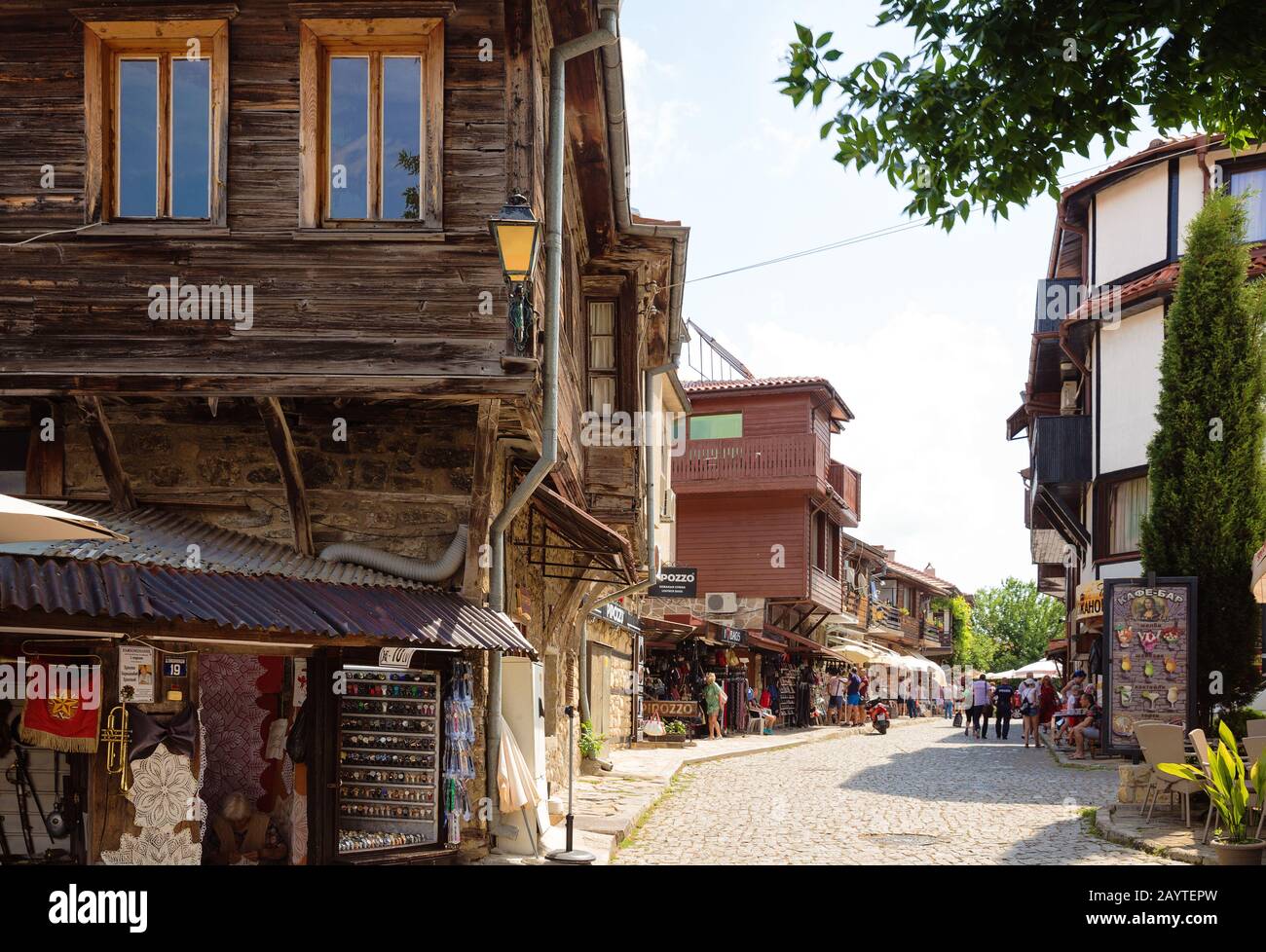 NESSEBAR, BULGARIA - JUNE 26, 2019: Tourists on street of resort town ...