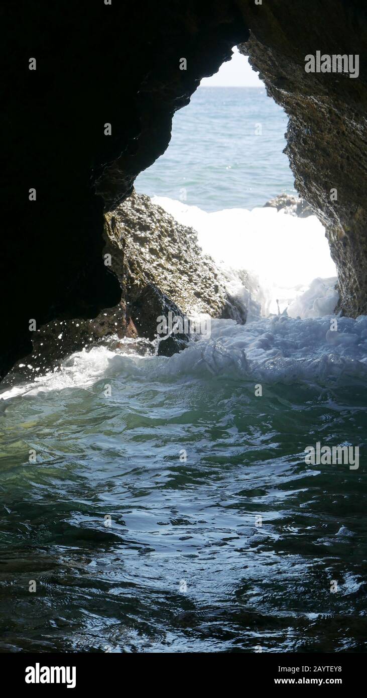 Seawater flows through a crevice of a rock facing the Last Islet in ...