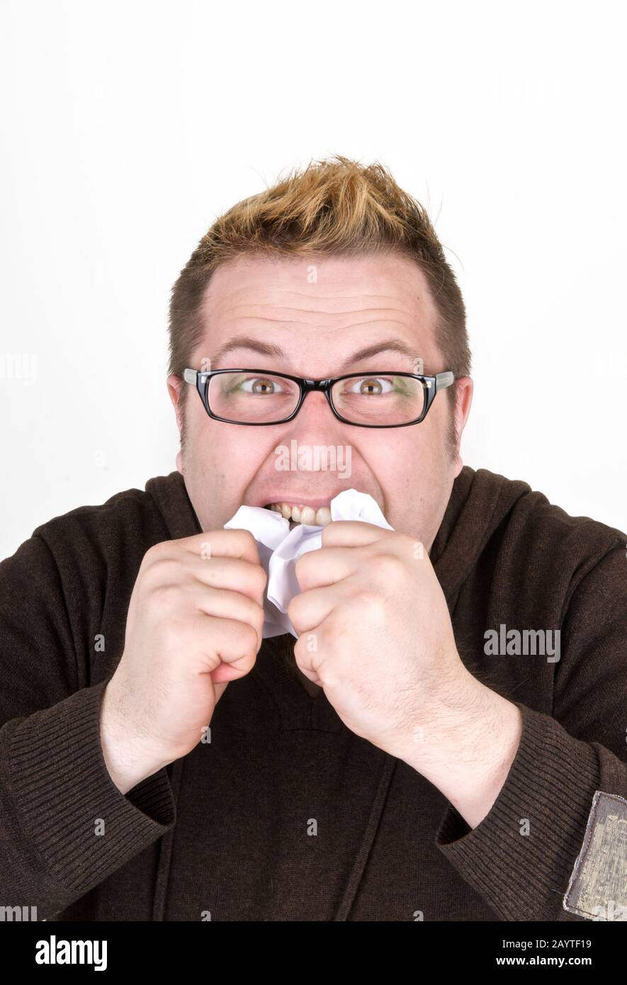 Shocked man eating a document Stock Photo - Alamy
