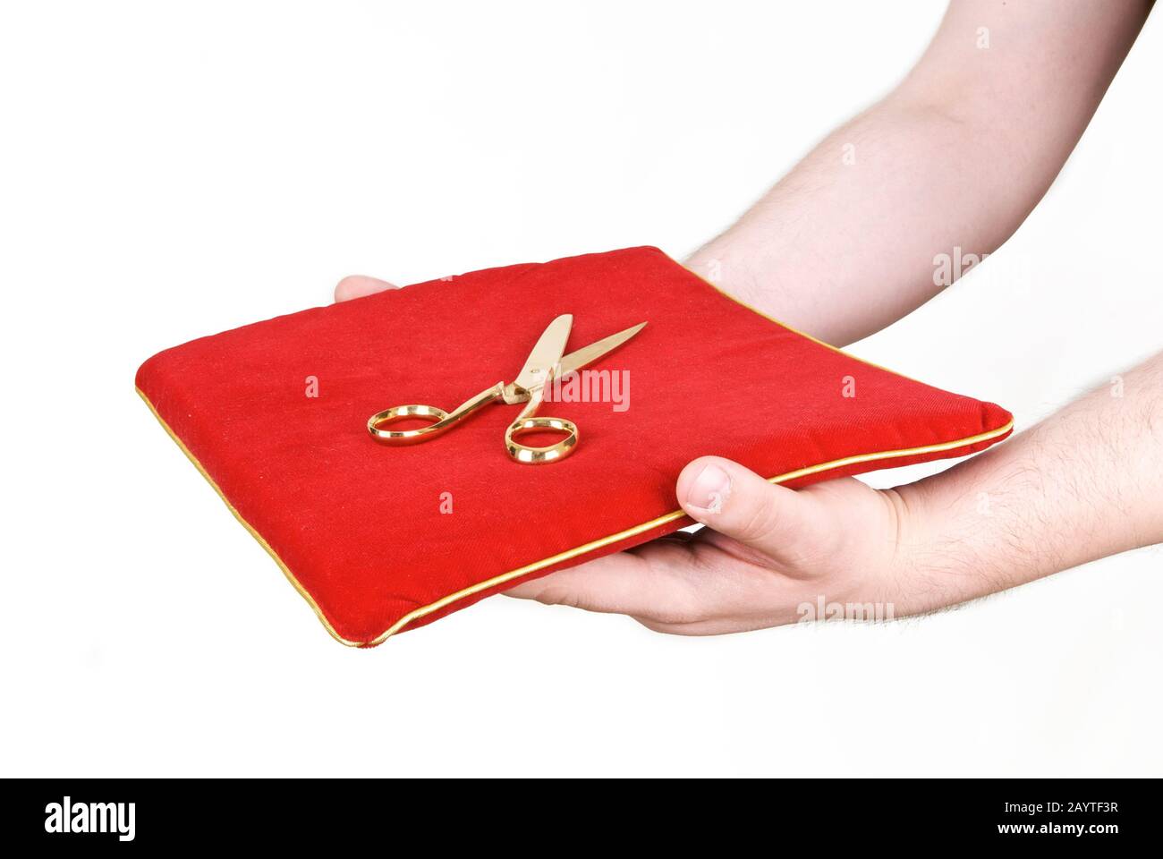Golden scissors on a red pillow Stock Photo - Alamy