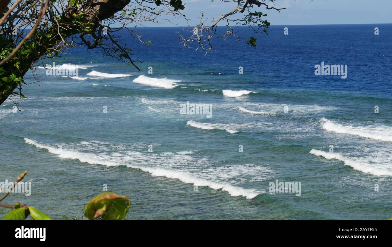 Gentle waves rolling toward the shore of Parola Beach, Cape San Agustin ...