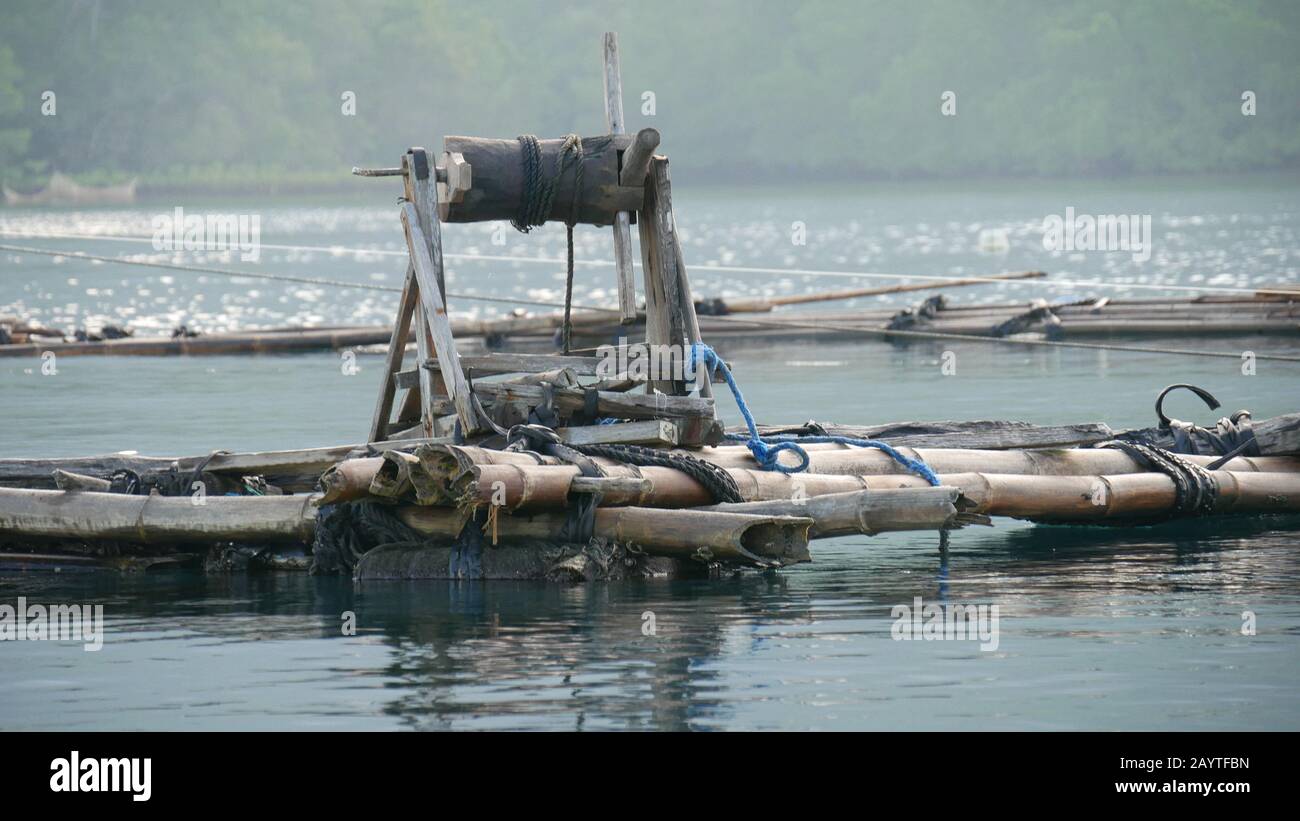 Close up of bamboo rafts floating on rubber tires at a fishing village ...