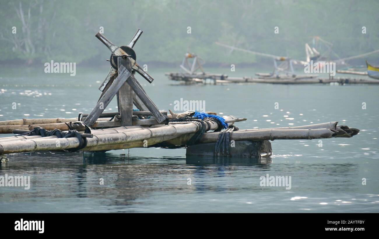 Bamboo raft floating on rubber tires at a fishing village in the ...
