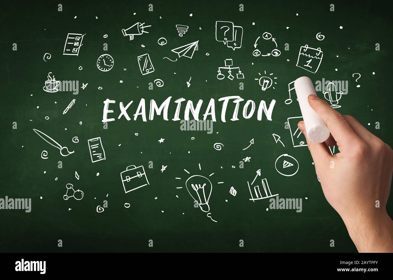 Hand drawing EXAMINATION inscription with white chalk on blackboard ...