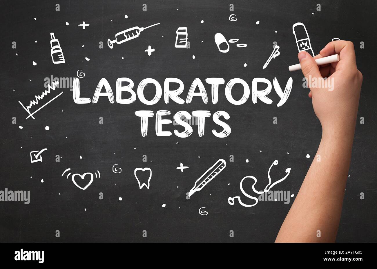 Hand drawing LABORATORY TESTS inscription with white chalk on ...