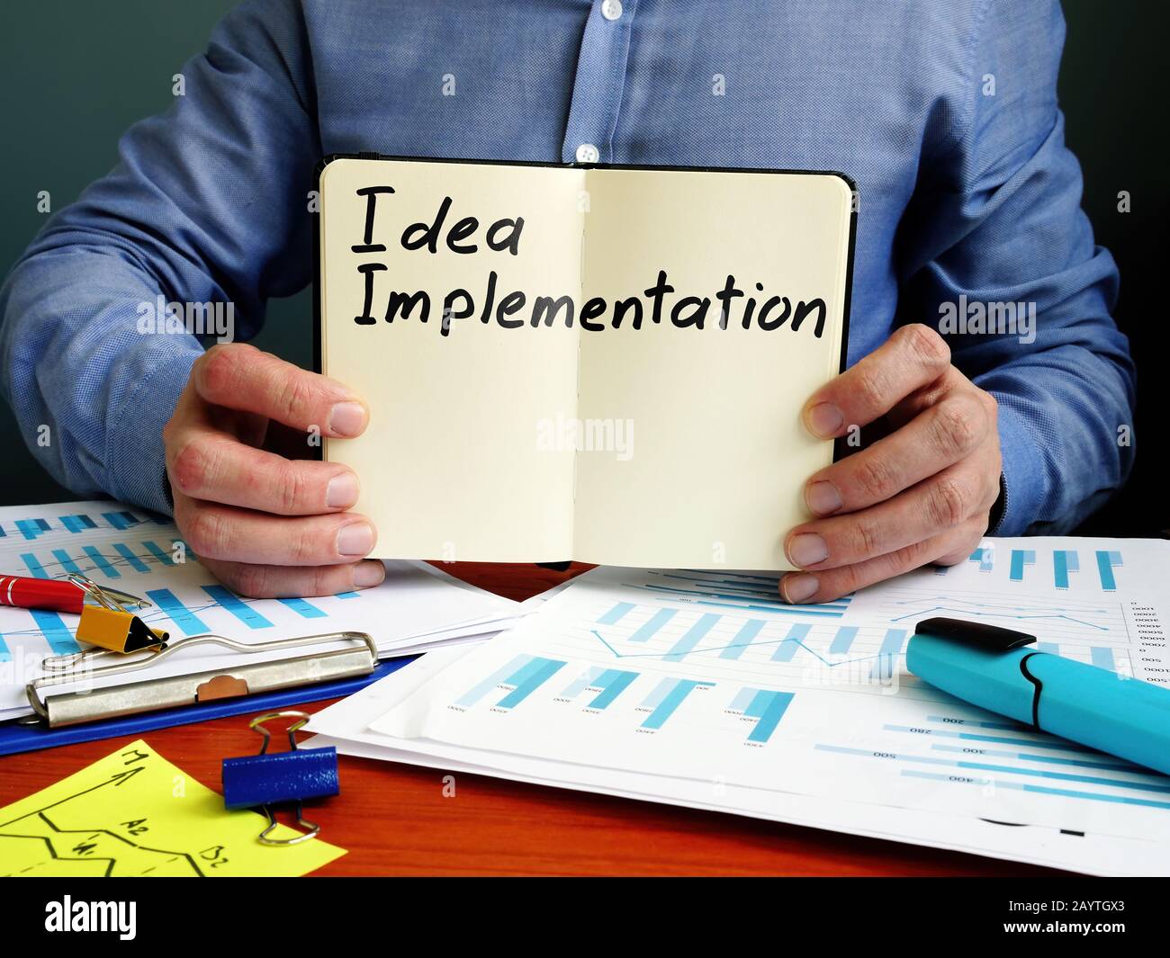 Idea Implementation plan in the small notepad Stock Photo - Alamy