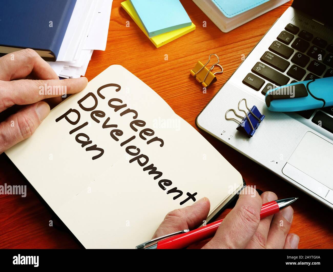 Employee is writing career development plan by pen Stock Photo - Alamy