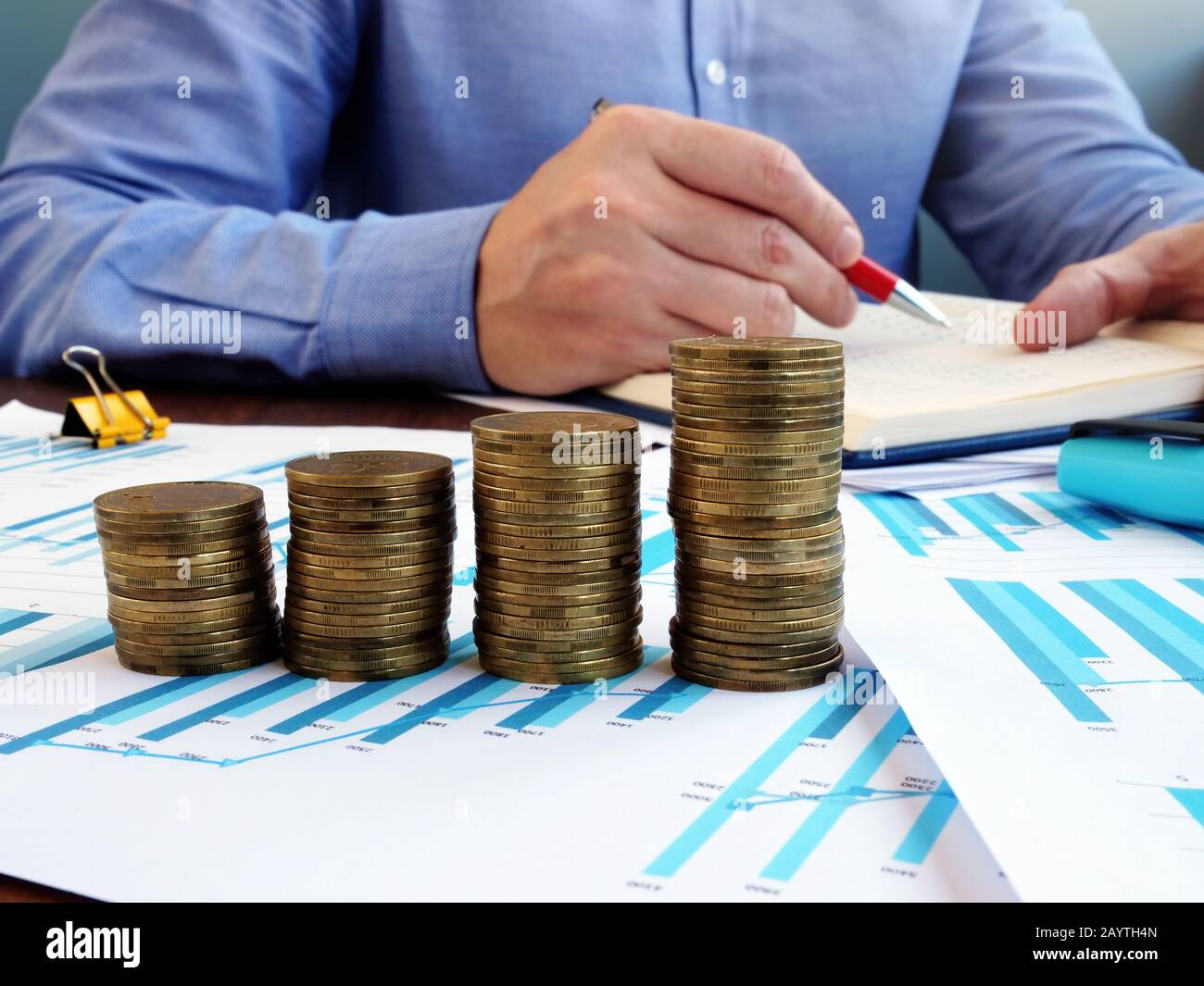 Wealth management and control savings. Stack of coins and accountant ...