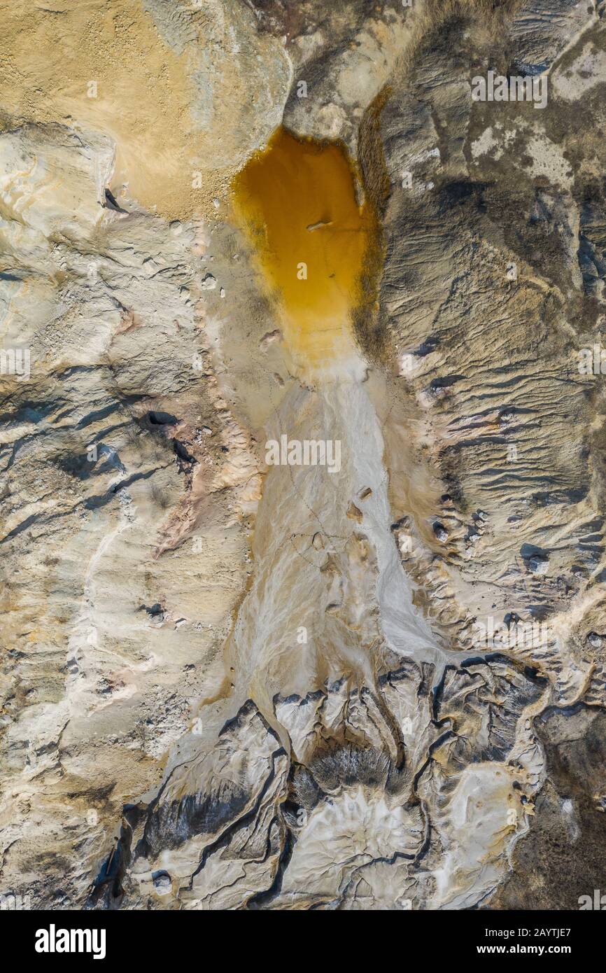 Aerial view of an open mine pit. Exploitation and nature pollution ...
