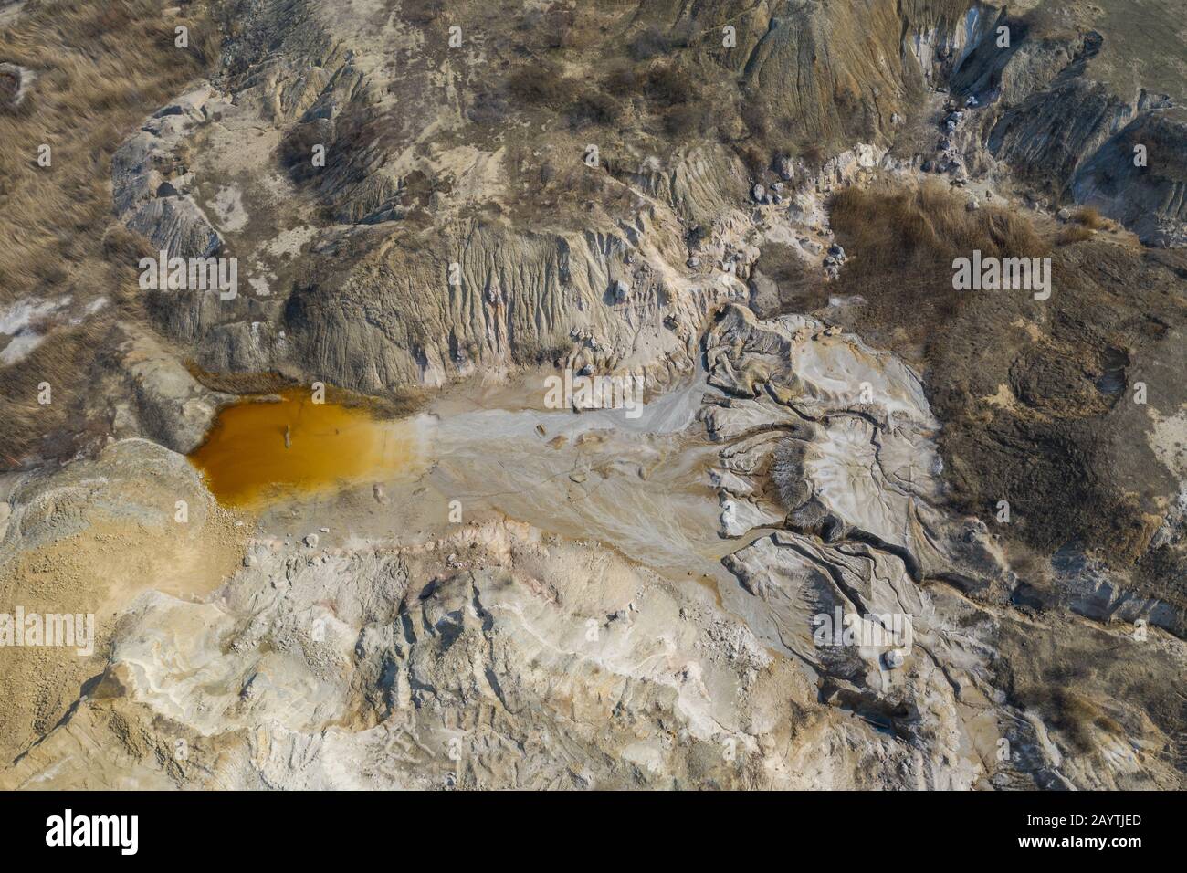 Aerial view of an open mine pit. Exploitation and nature pollution ...
