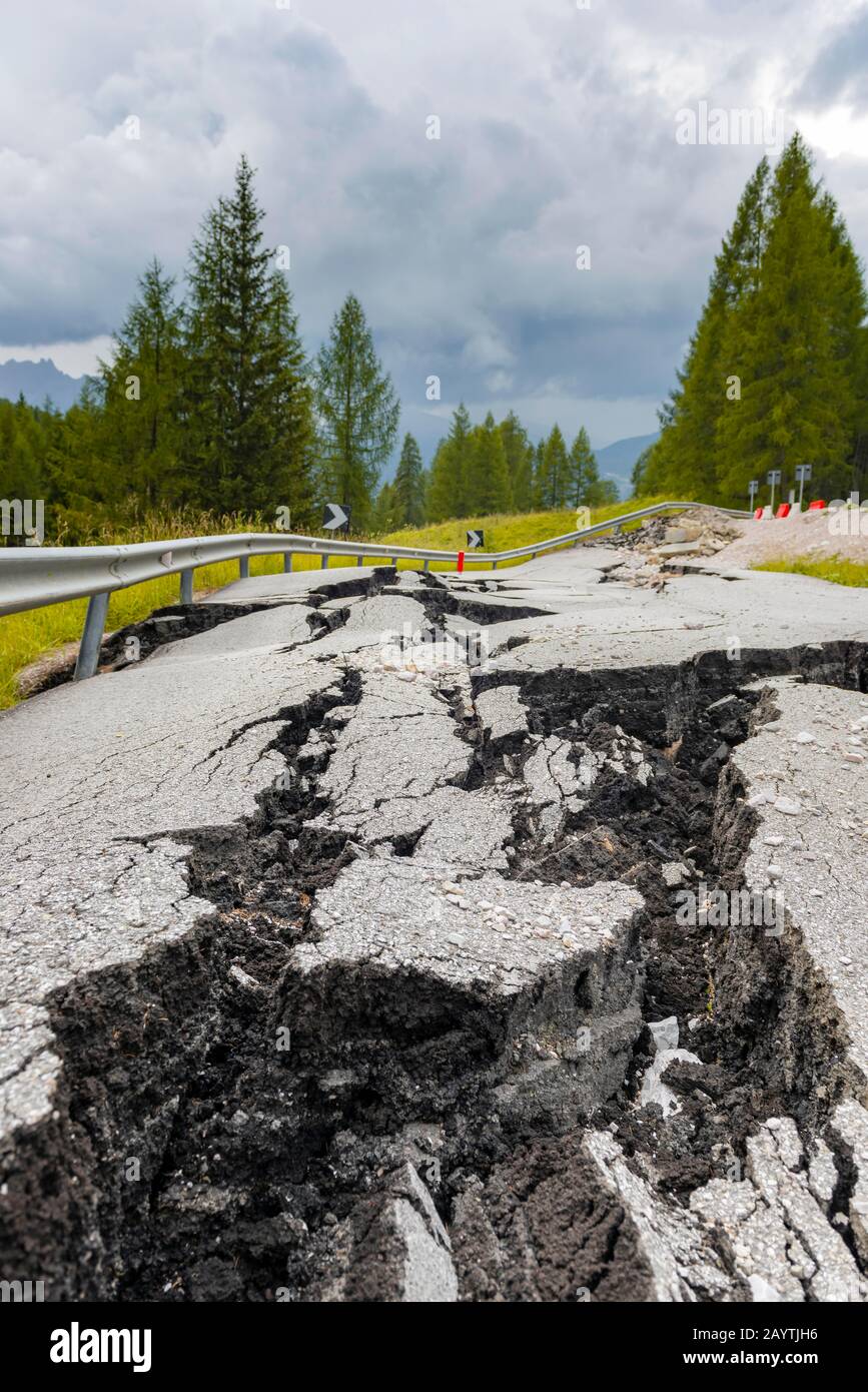 Broken road with cracks in the road surface, broken roadway of a ...