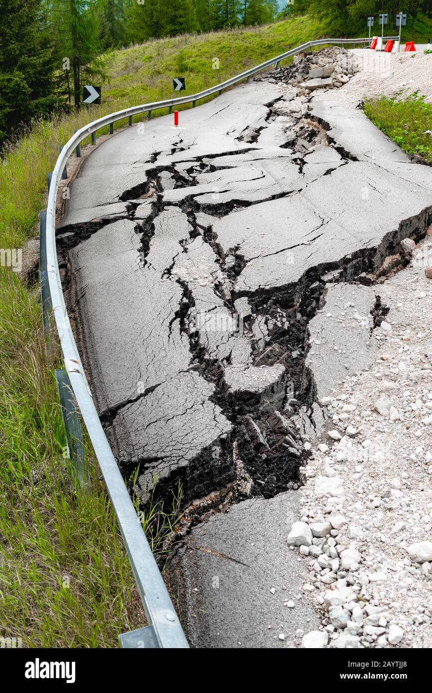 Broken road with cracks in the road surface, broken roadway of a ...