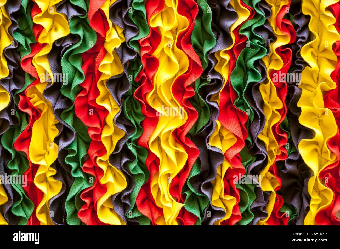 Full frame textured background of colorful layers of ruffled fabric ...