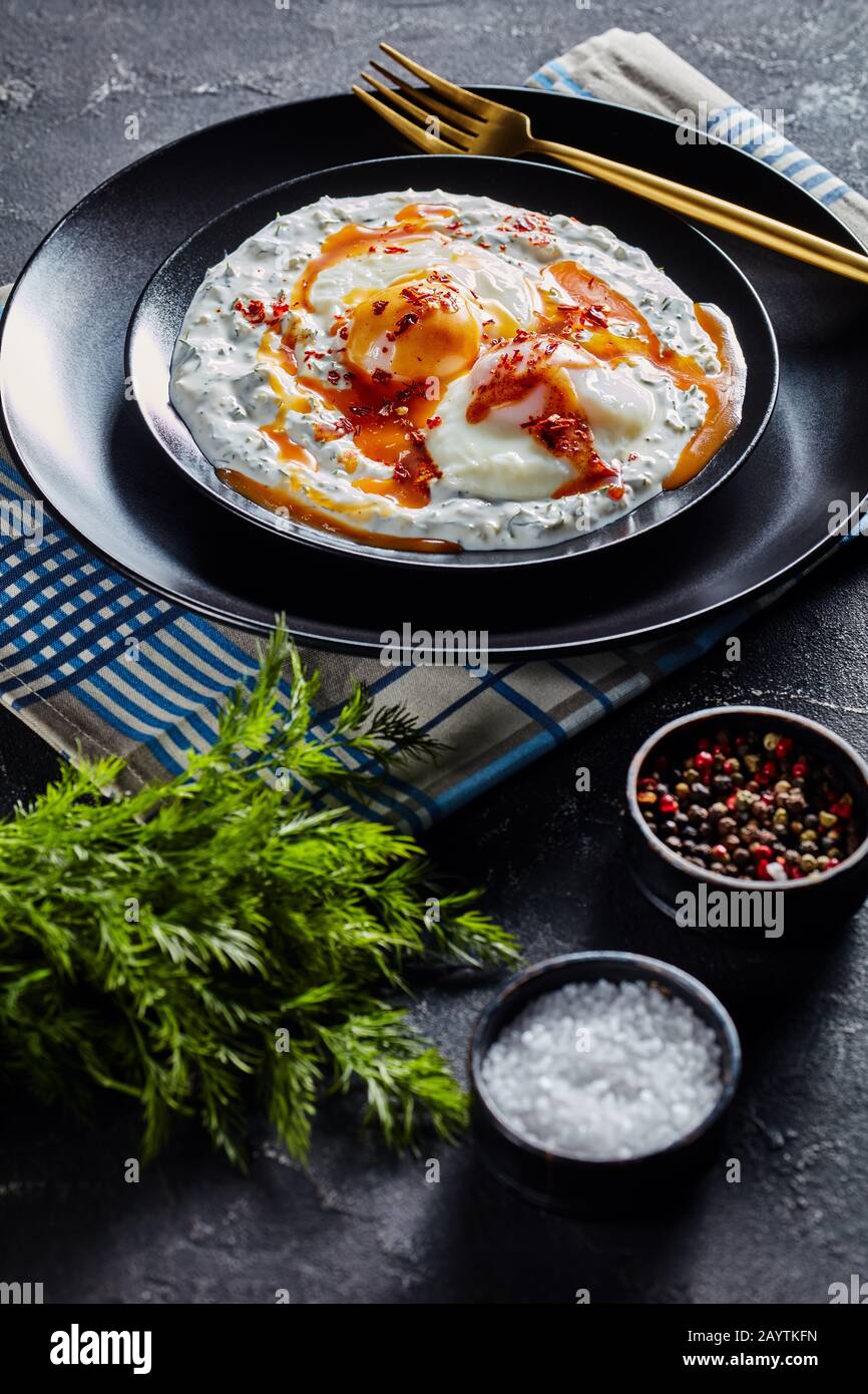 traditional turkish breakfast, cilbir, poached eggs in yogurt sauce ...