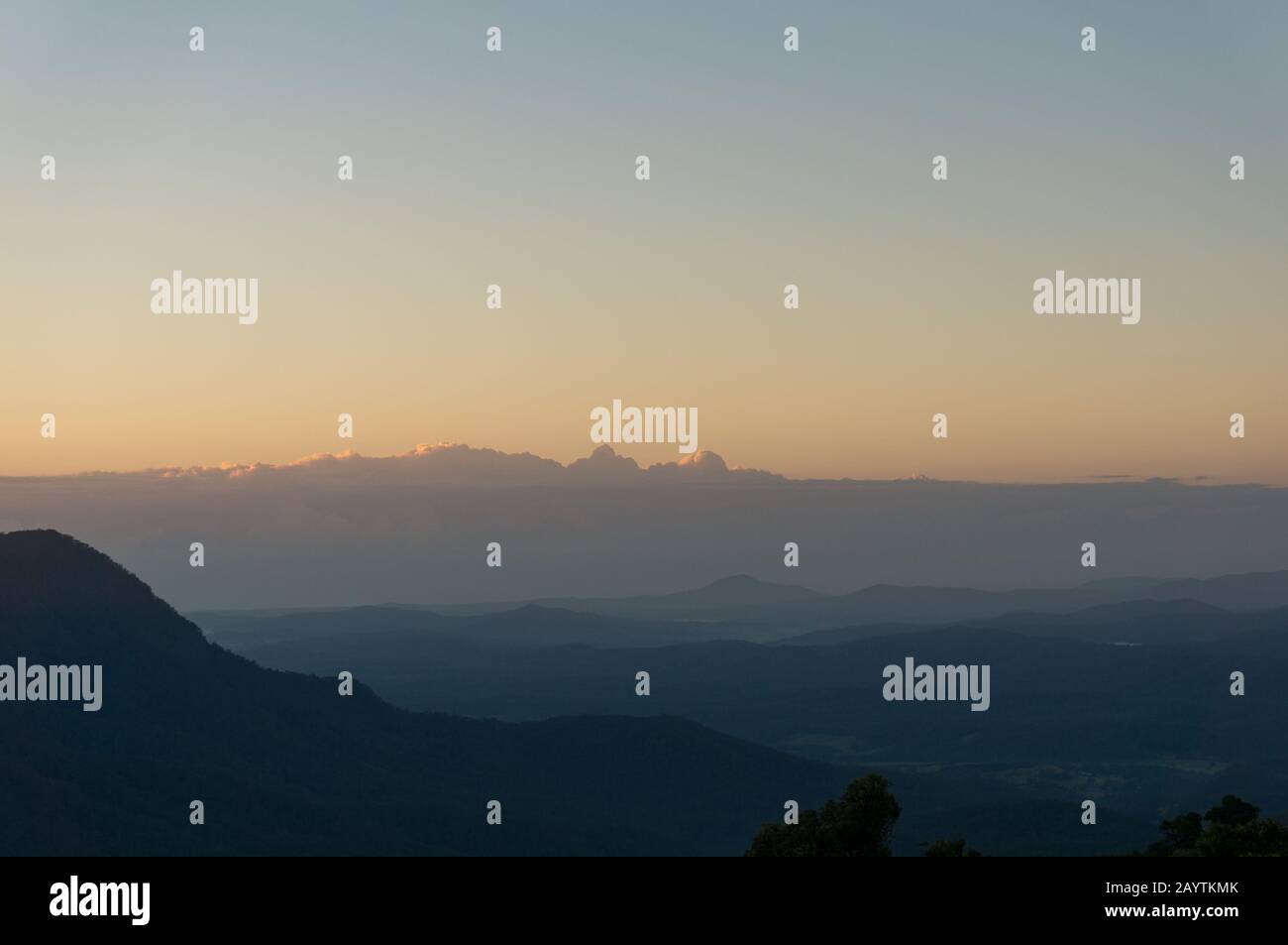 View from above on mountains at sunrise. Layers of mountains, hills ...
