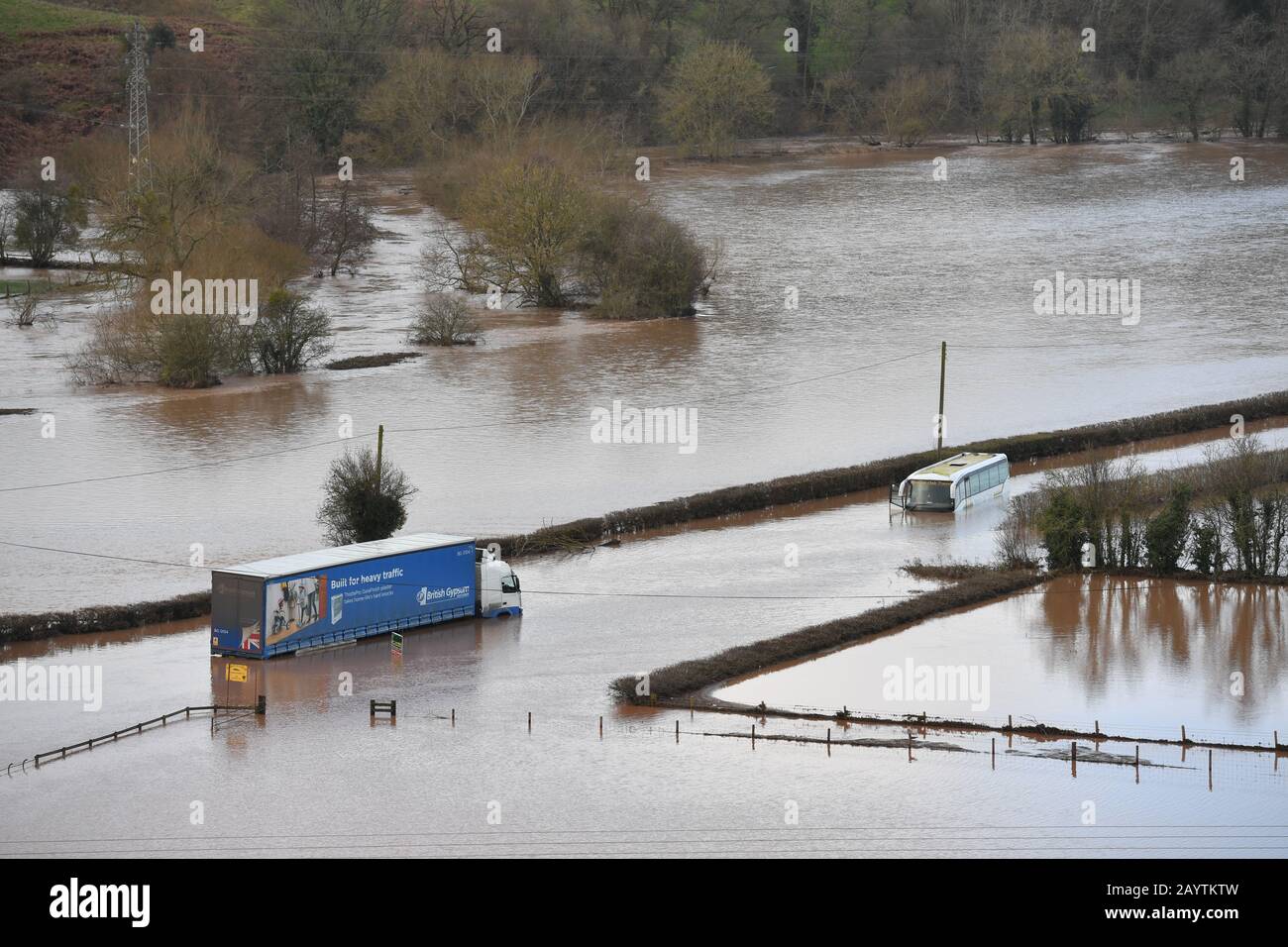 A lorry and a coach submerged in floodwater from the River Teme on the ...