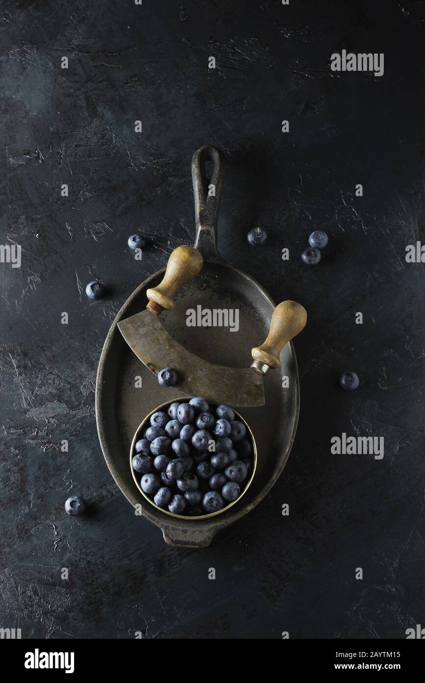 mystic light blueberries on dark background Stock Photo - Alamy