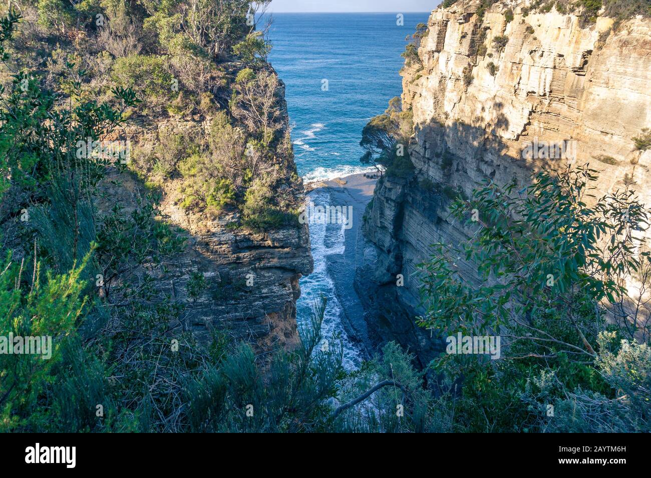 View of narrow cliff gulch, gorge and open ocean. Nature background ...