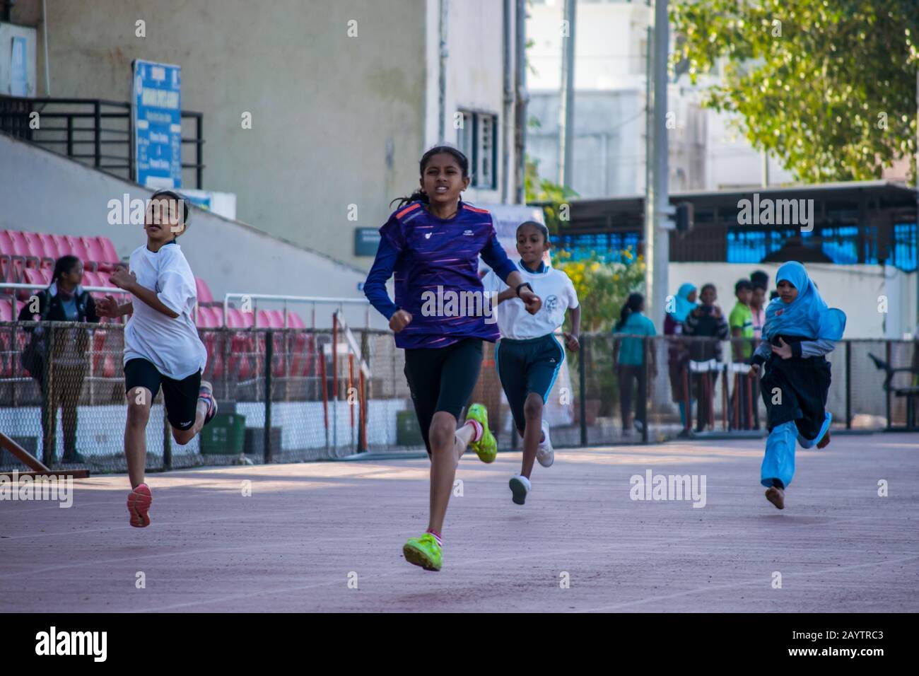 Girls running in 100 meter race compition Stock Photo - Alamy