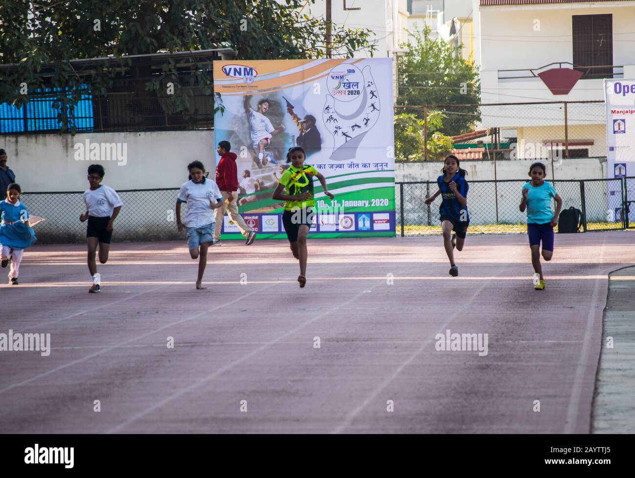 Girls running in 100 meter race compition Stock Photo - Alamy