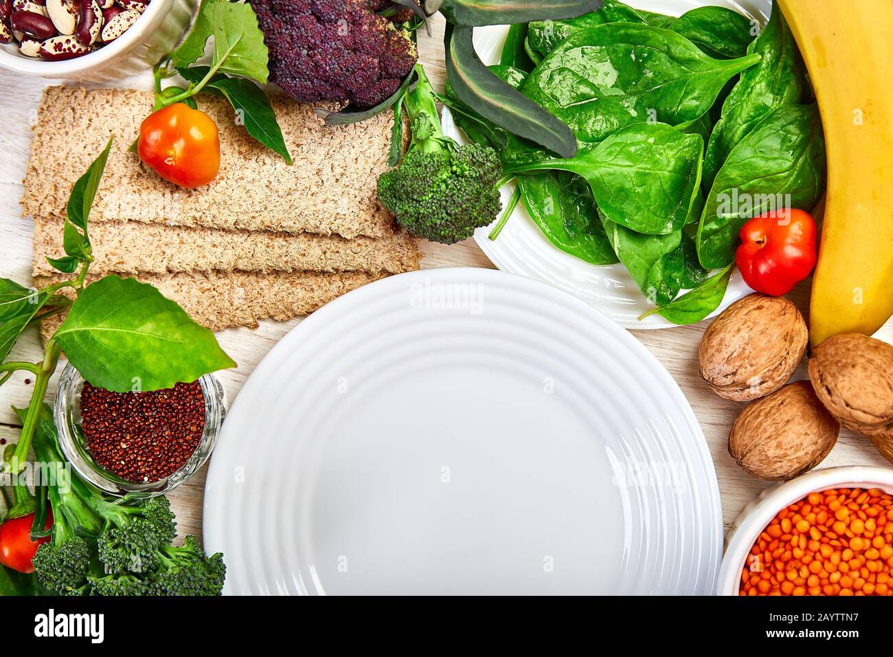 Selection food rich in fiber on white wooden background around empty ...