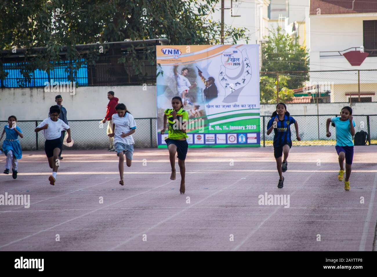 Girls running in 100 meter race compition Stock Photo - Alamy