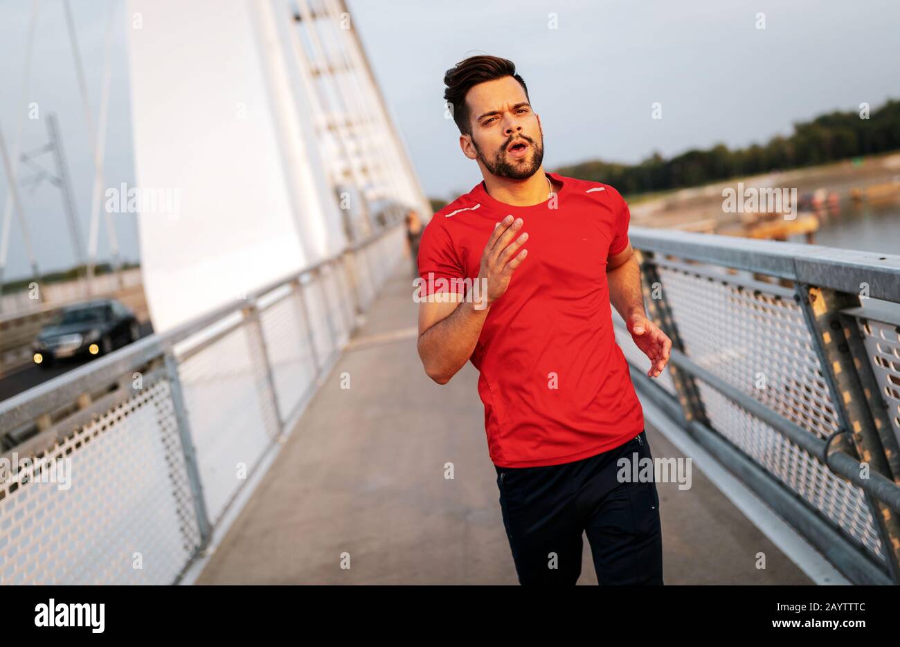 Fit young man running outdoor. Healthy lifestyle concept Stock Photo ...