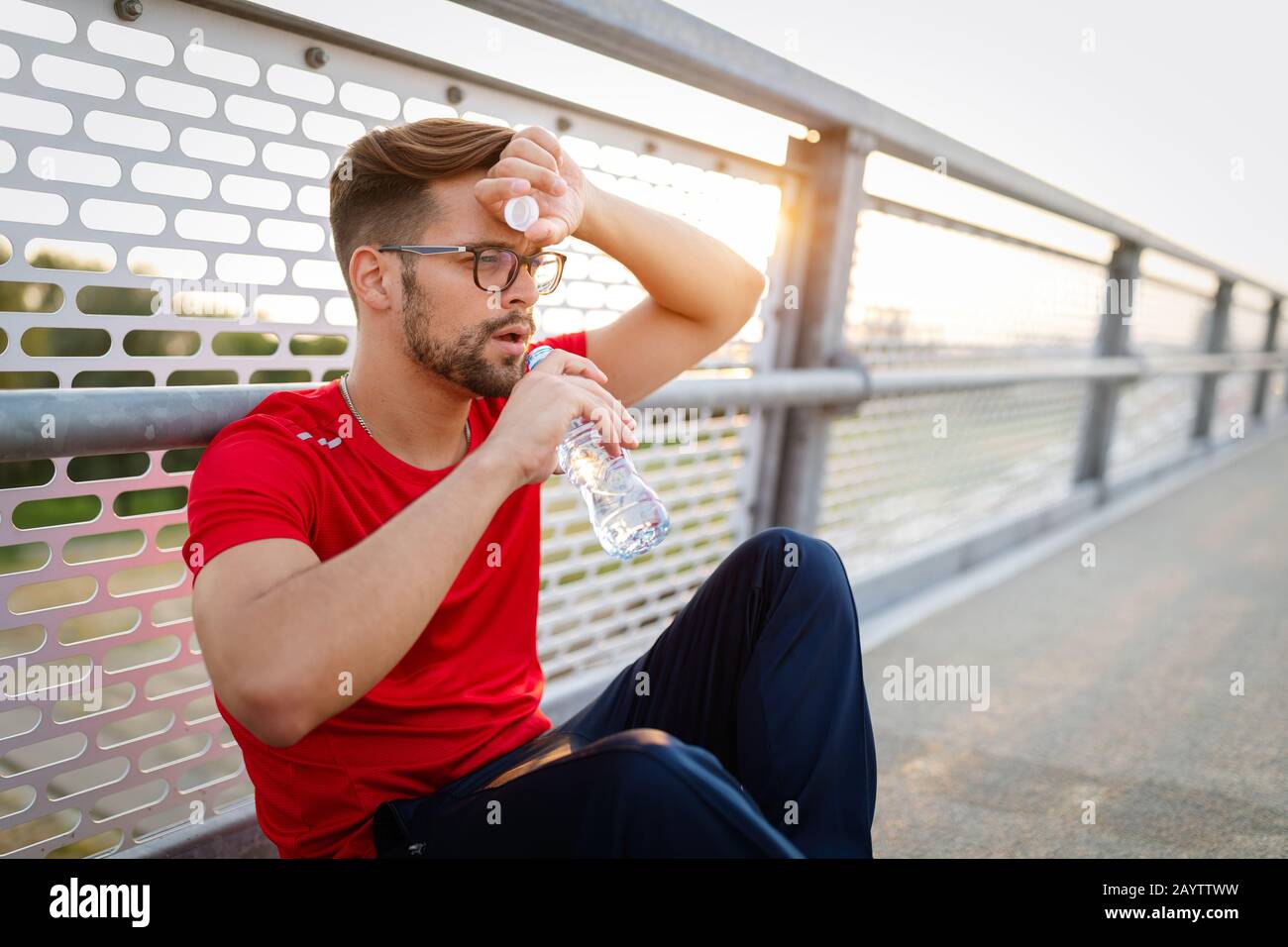 Running male adult taking a break. Tired exhausted man runner sweating ...