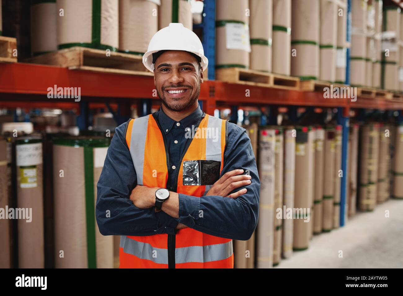 Confident african american man standing with folded arms in ...