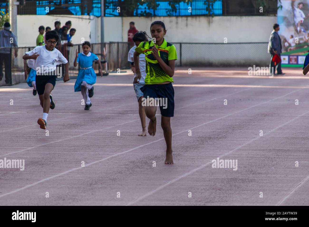 Girls running in 100 meter race compition Stock Photo - Alamy