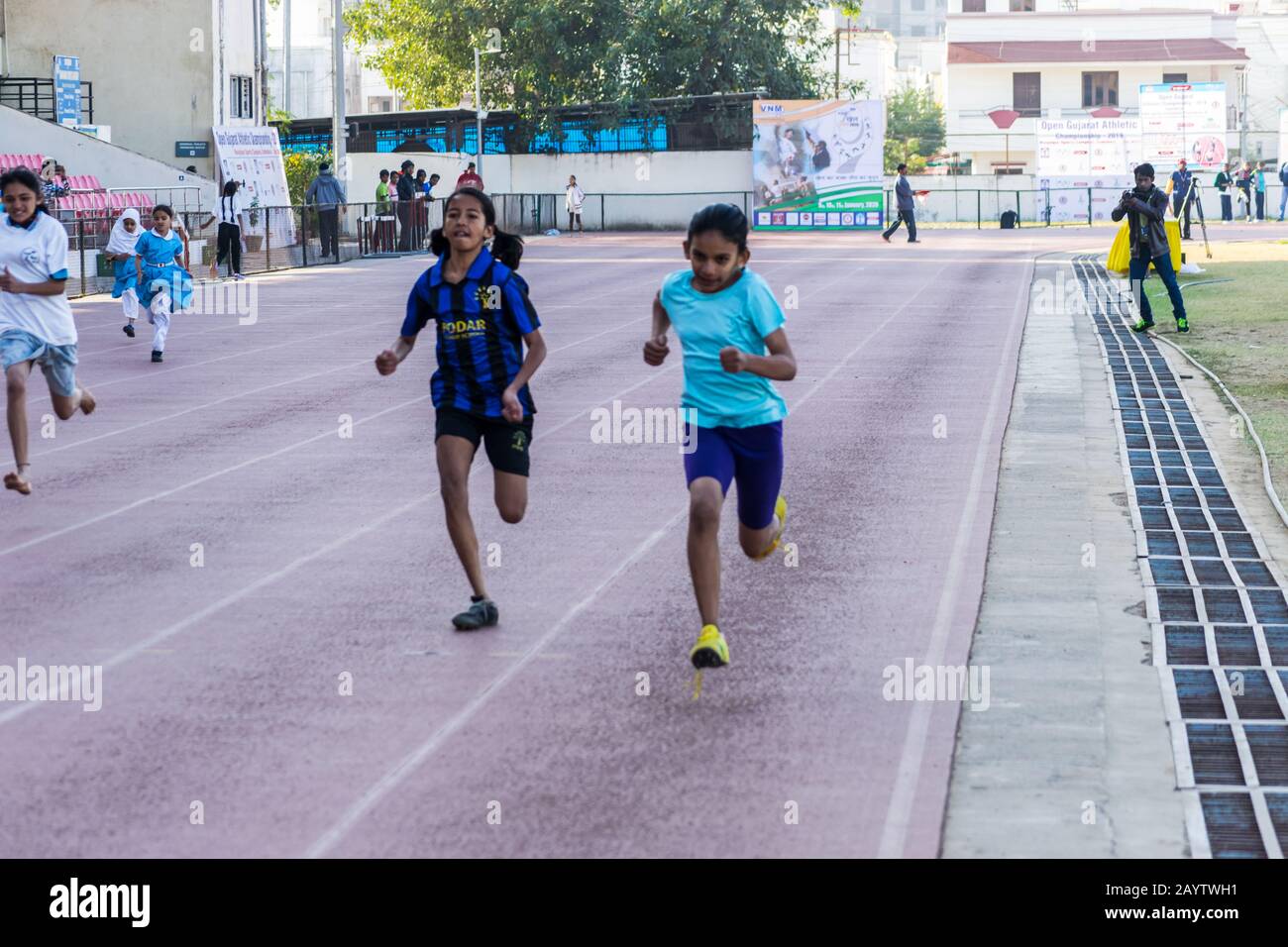 Girls running in 100 meter race compition Stock Photo - Alamy