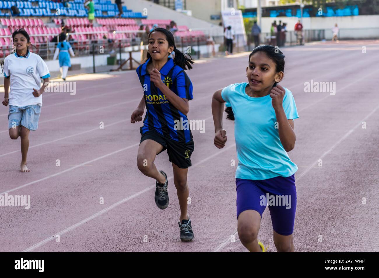 Girls running in 100 meter race compition Stock Photo - Alamy