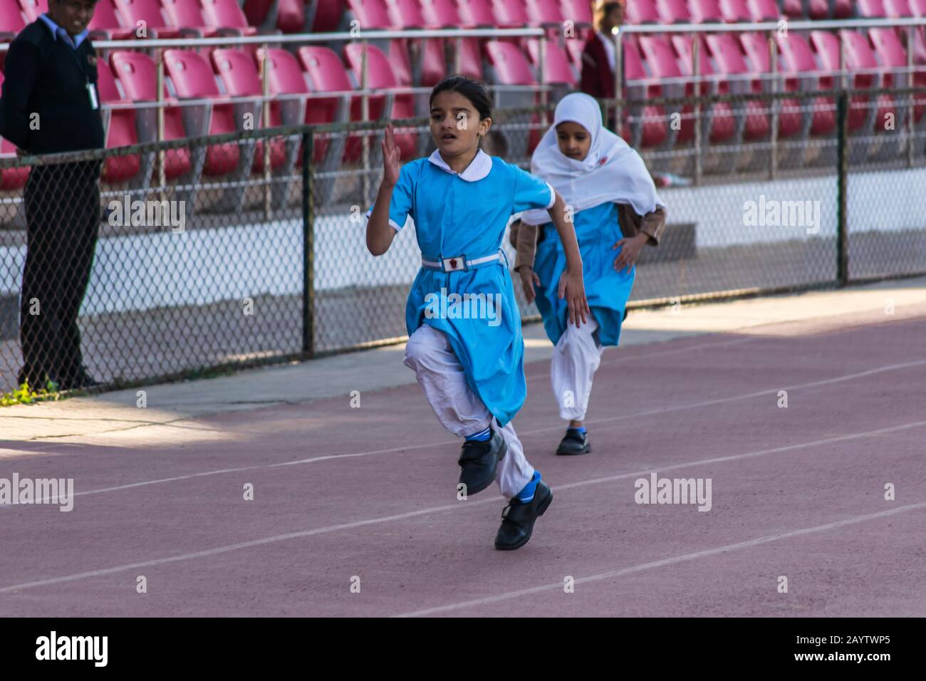 Girls running in 100 meter race compition Stock Photo - Alamy
