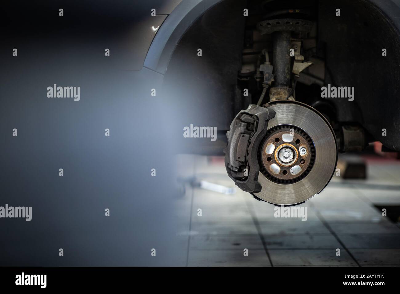 Mechanic changing a wheel of a modern car (color toned image Stock ...