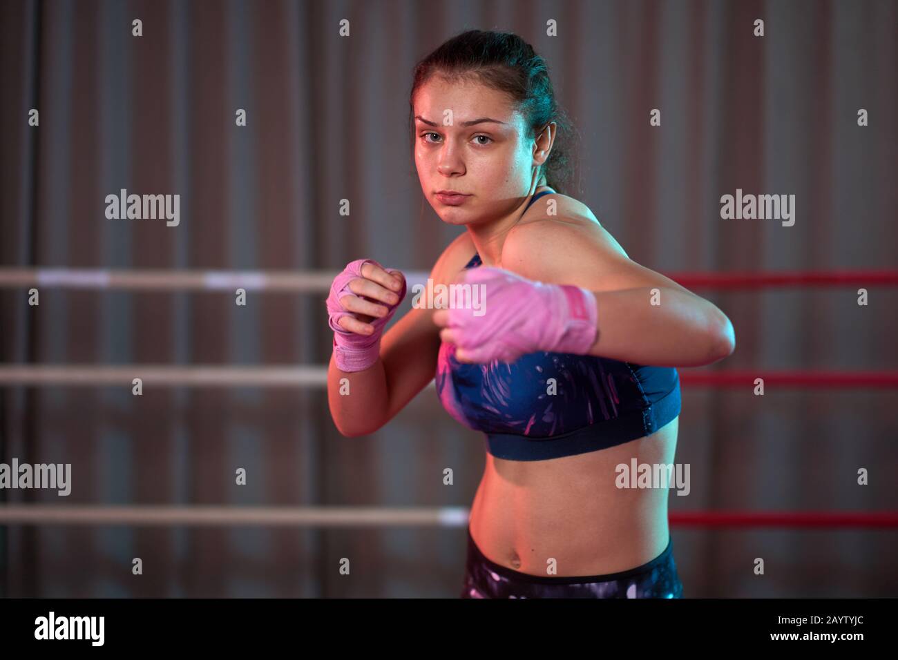 Kickboxer girl shadow boxing in the ring before sparring Stock Photo ...