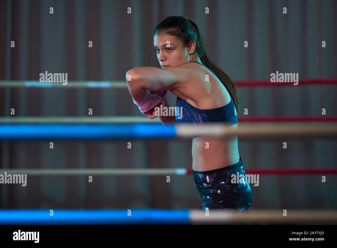 Kickboxer girl shadow boxing in the ring before sparring Stock Photo ...