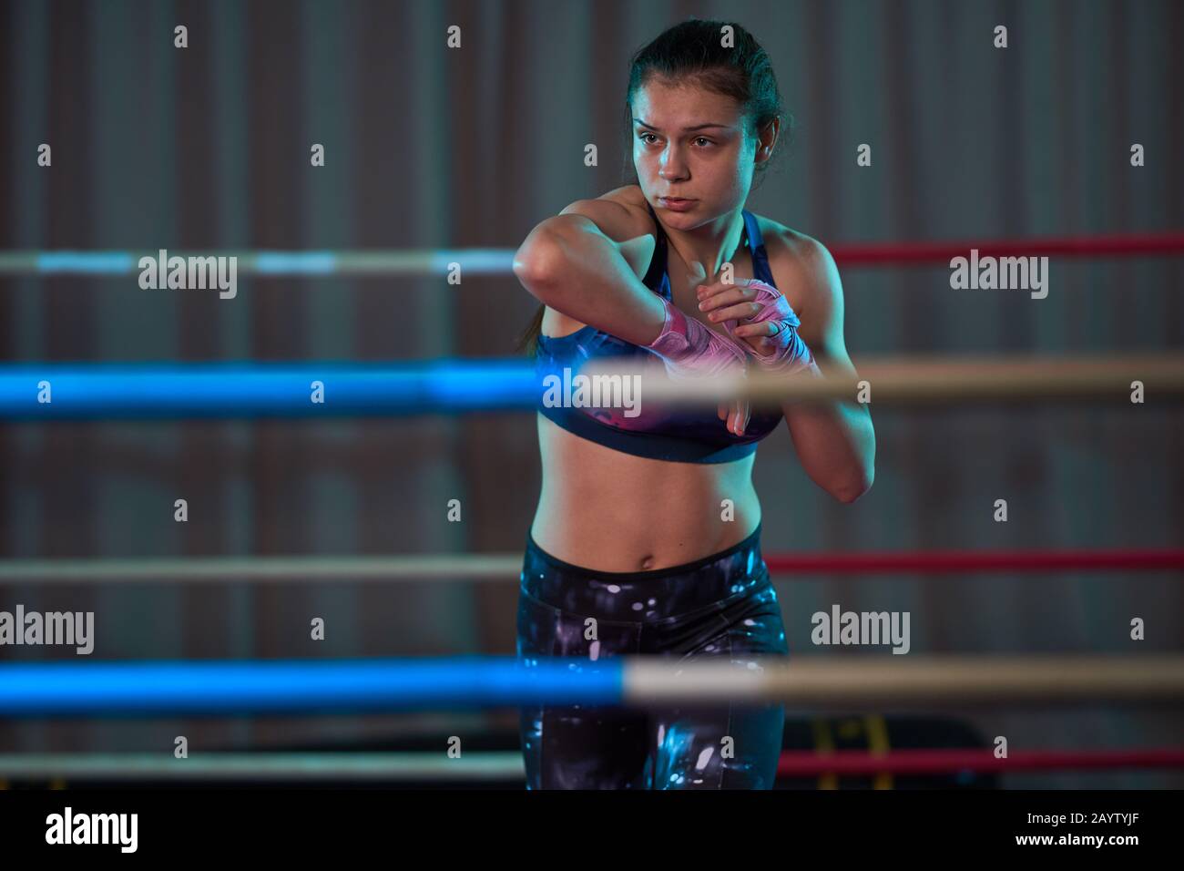 Kickboxer girl shadow boxing in the ring before sparring Stock Photo ...