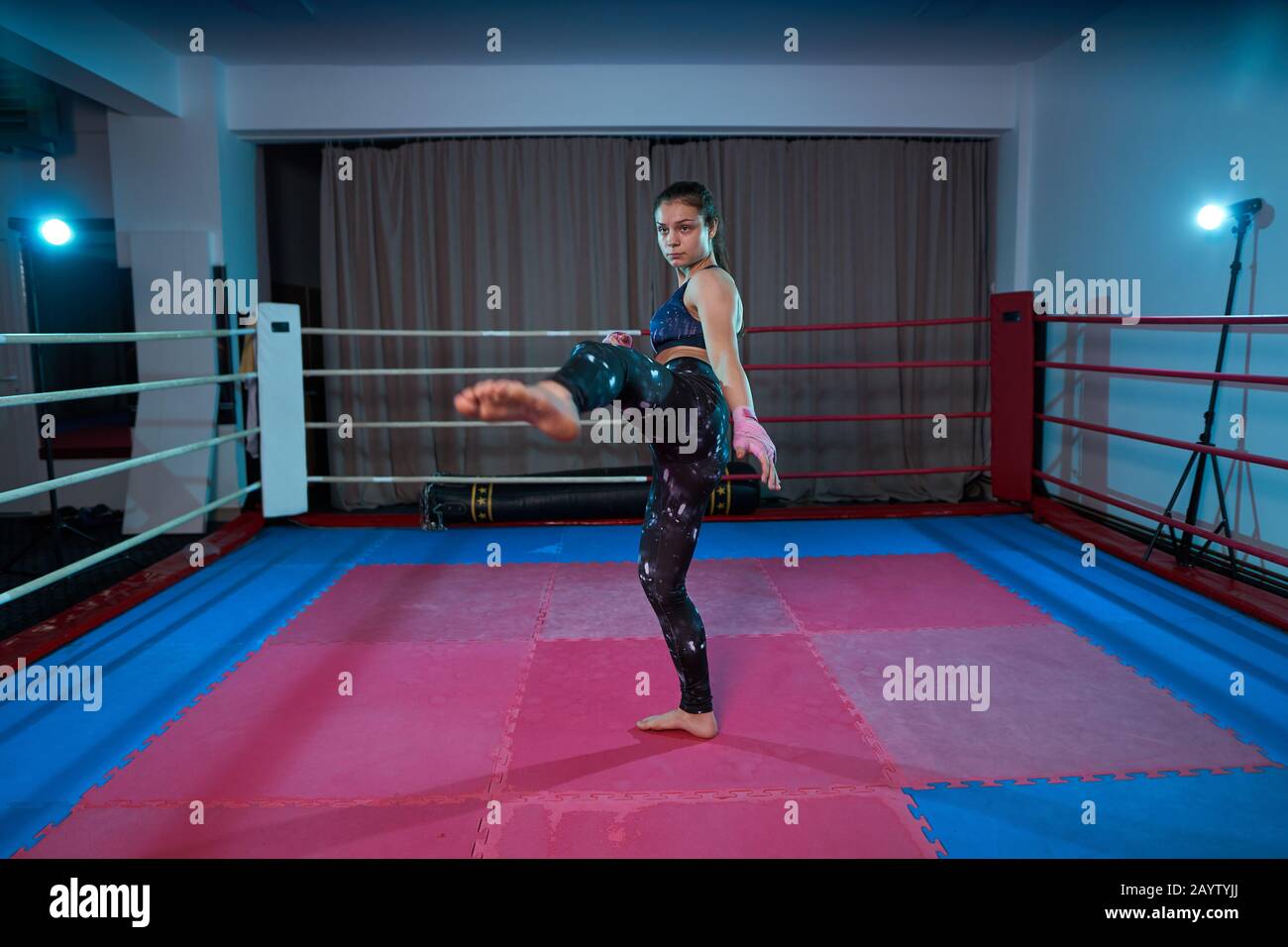 Kickboxer girl shadow boxing in the ring before sparring Stock Photo ...