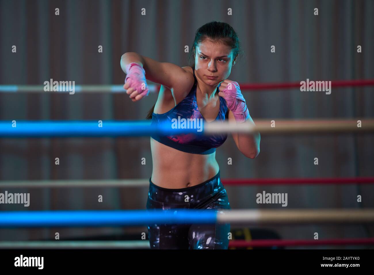 Kickboxer girl shadow boxing in the ring before sparring Stock Photo ...
