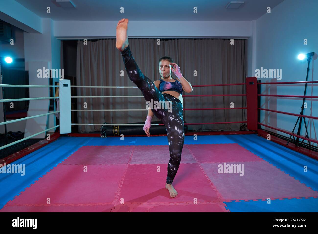 Kickboxer girl shadow boxing in the ring before sparring Stock Photo ...