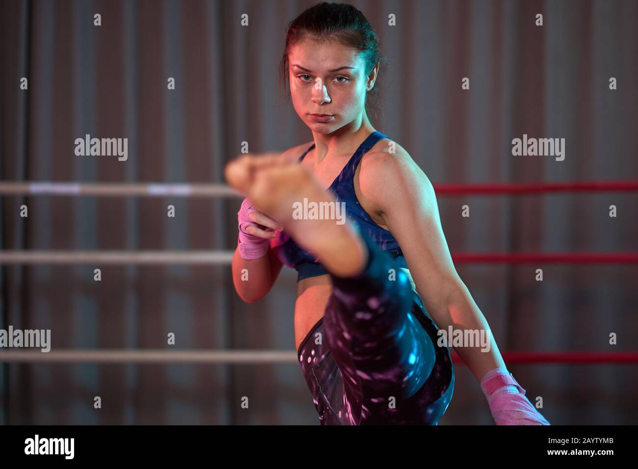 Kickboxer girl shadow boxing in the ring before sparring Stock Photo ...