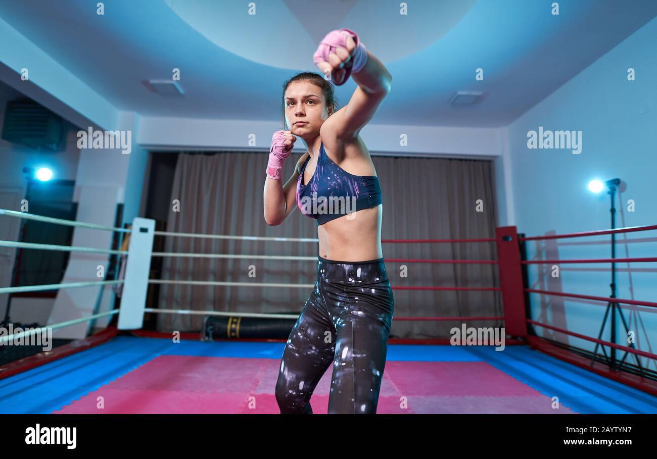 Kickboxer girl shadow boxing in the ring before sparring Stock Photo ...