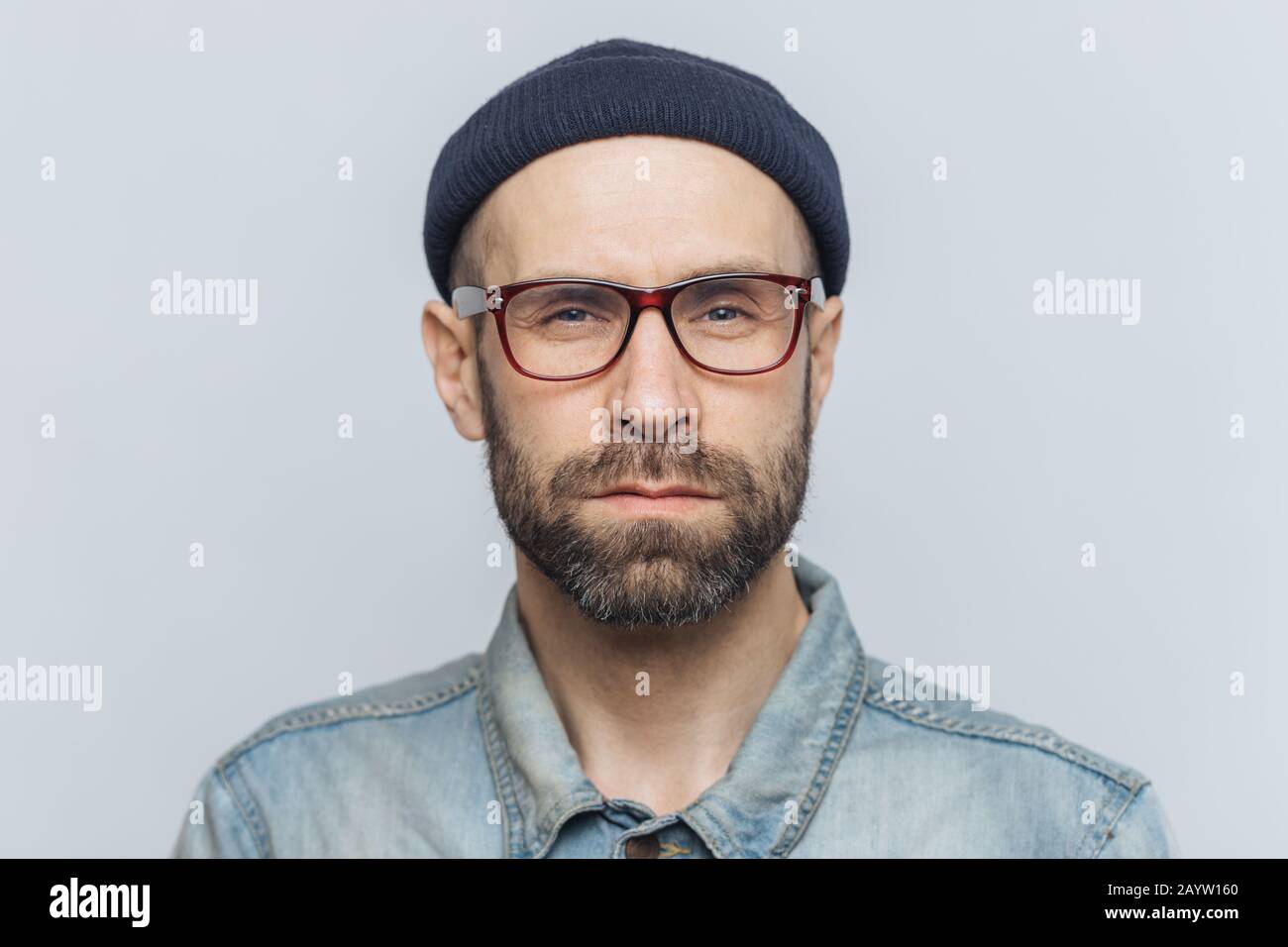 Photo of intelligent confident stylish man with dark thick beard and ...