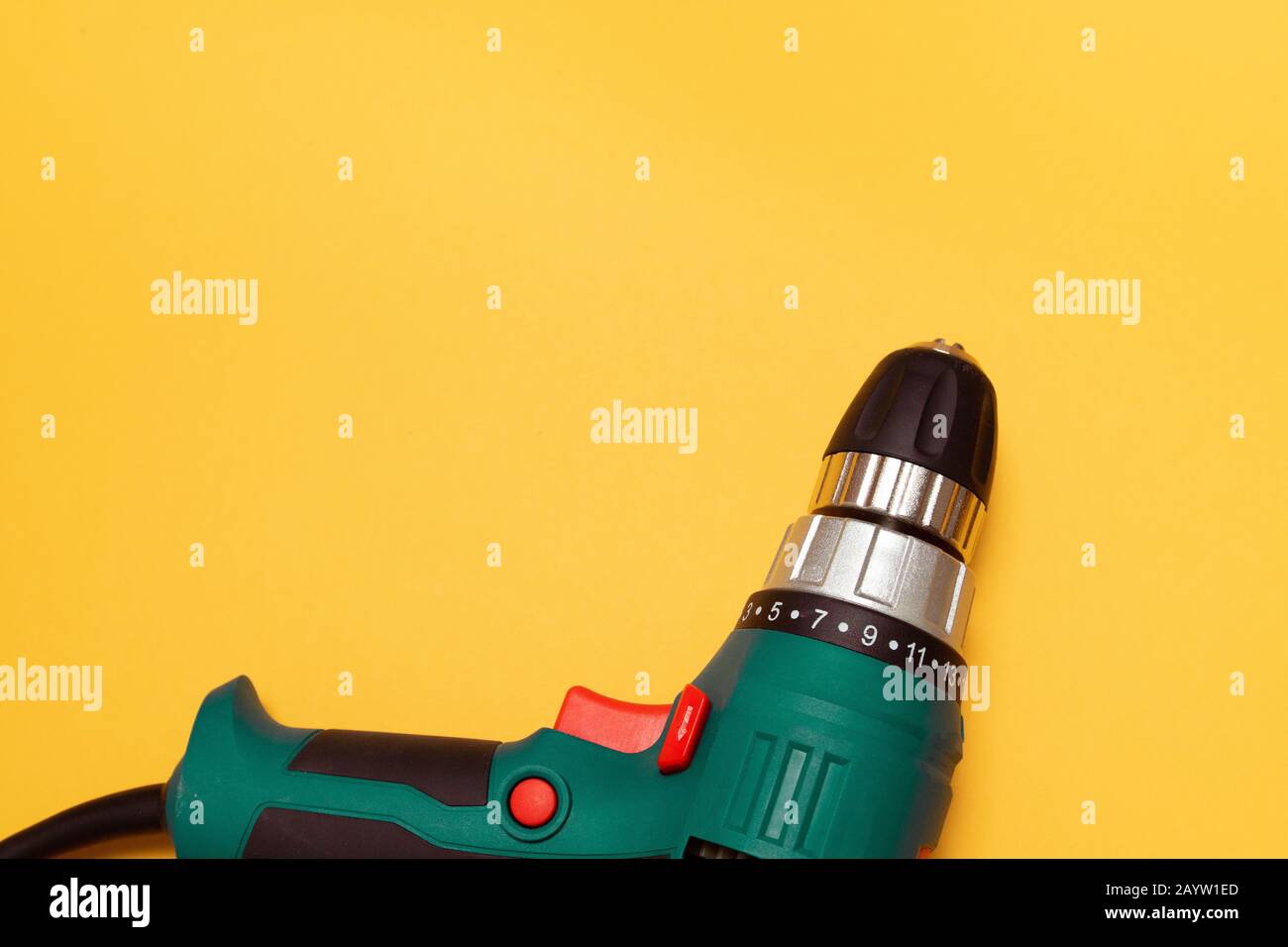 Heavy screwdriver on a yellow background with copyspace Stock Photo - Alamy