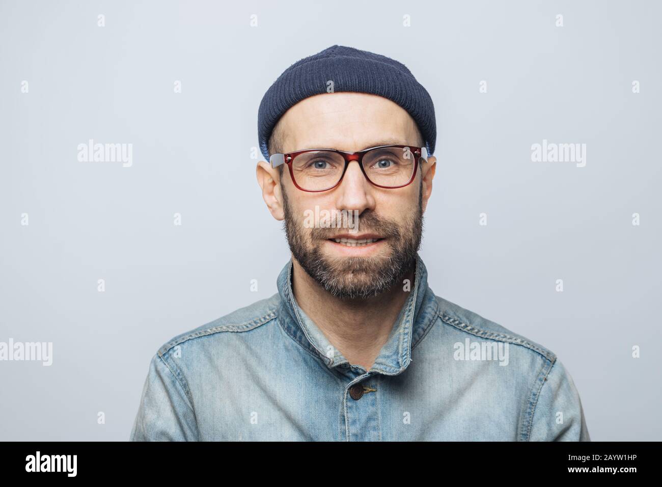 Portrait of handsome stylish male journalist wears eyewear, fashionable ...