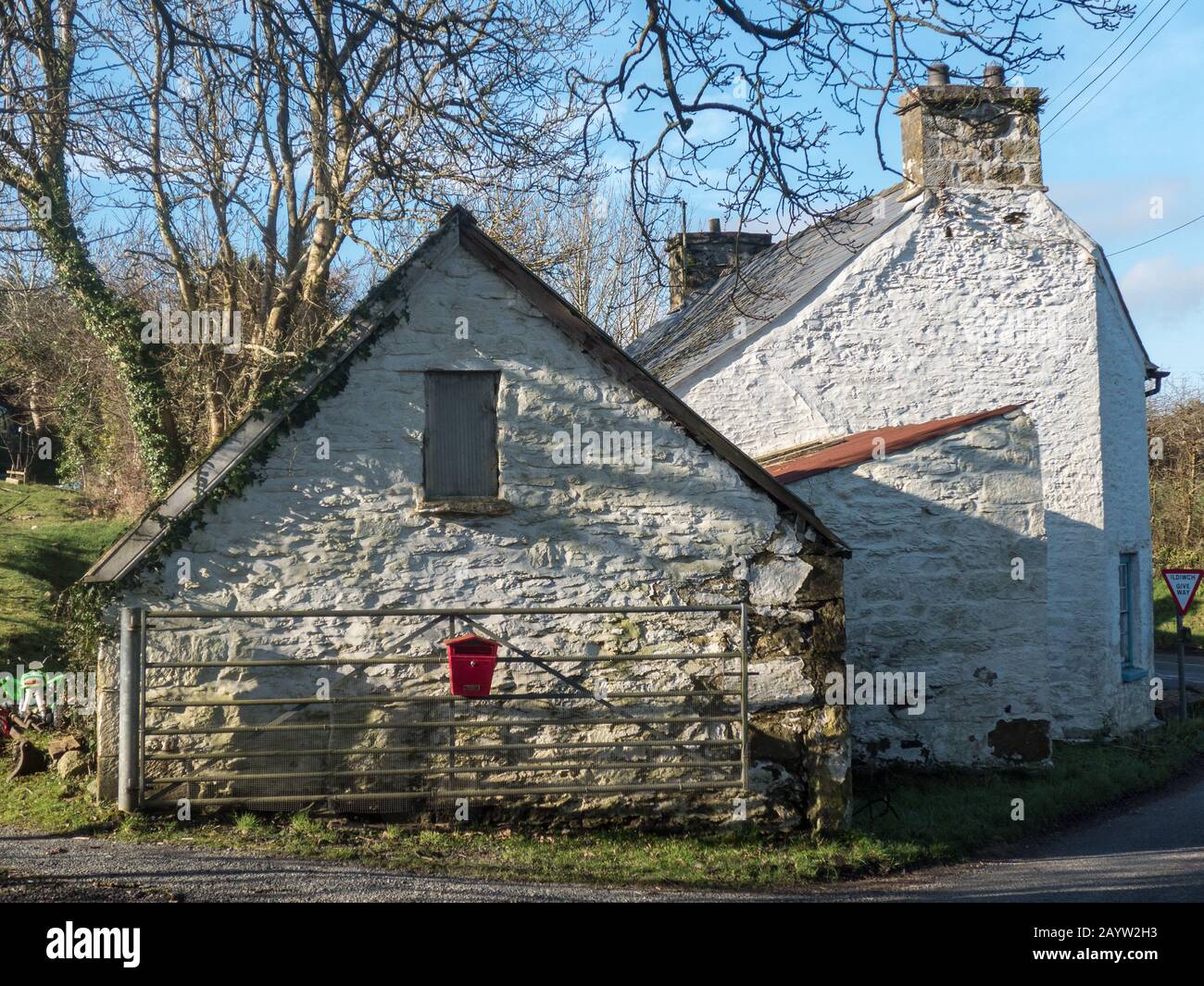 Old Welsh stone buildings, red post box on gate Stock Photo - Alamy