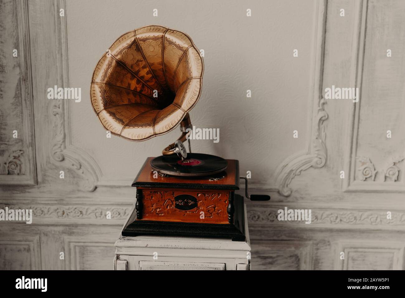 Old record player against ancient wooden wall. Antique gramophone with ...